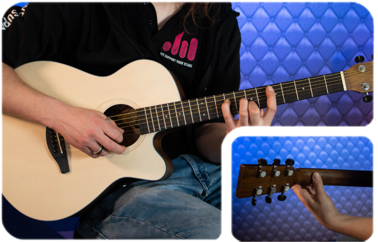 How To Hold a Guitar - Standing Up or Sitting Down